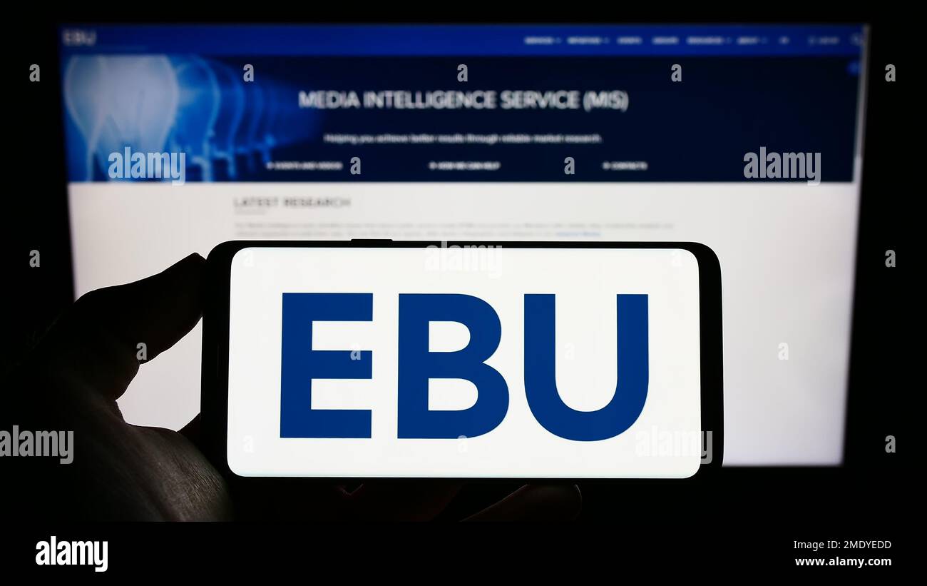 Person holding cellphone with logo of European European Broadcasting ...