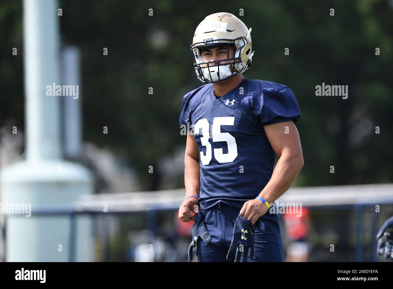 Navy running back Mike Mauai (35) looks on during work outs for the ...