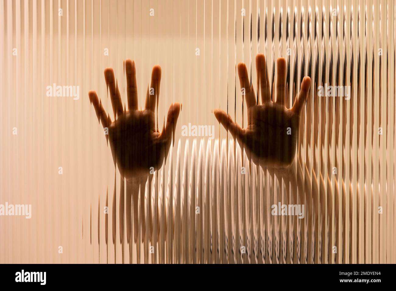 Hands on the textured glass Stock Photo - Alamy