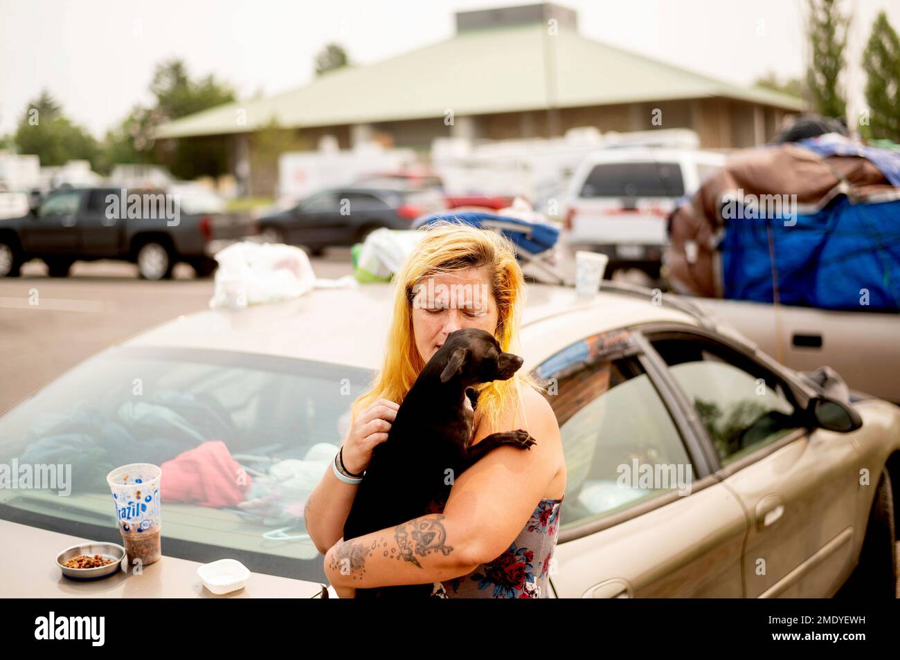 April Phillips, a Chester resident evacuated from the Dixie Fire, holds ...
