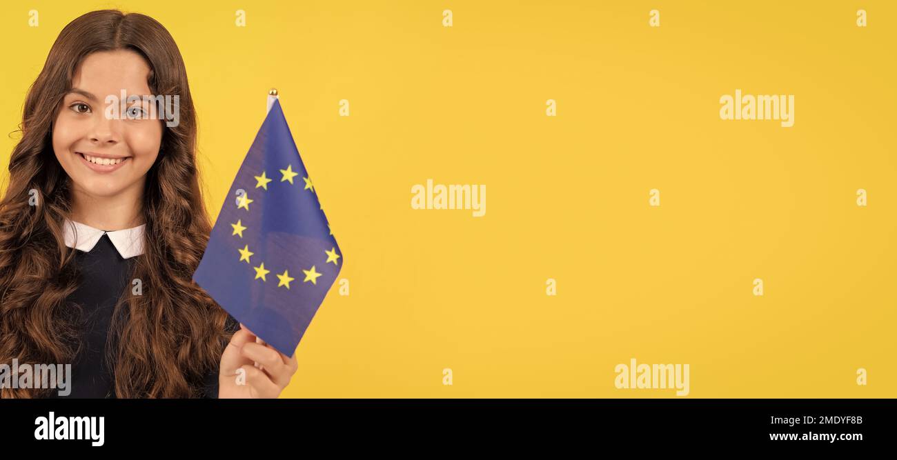 cheerful teen girl hold european union and german flag yellow ...