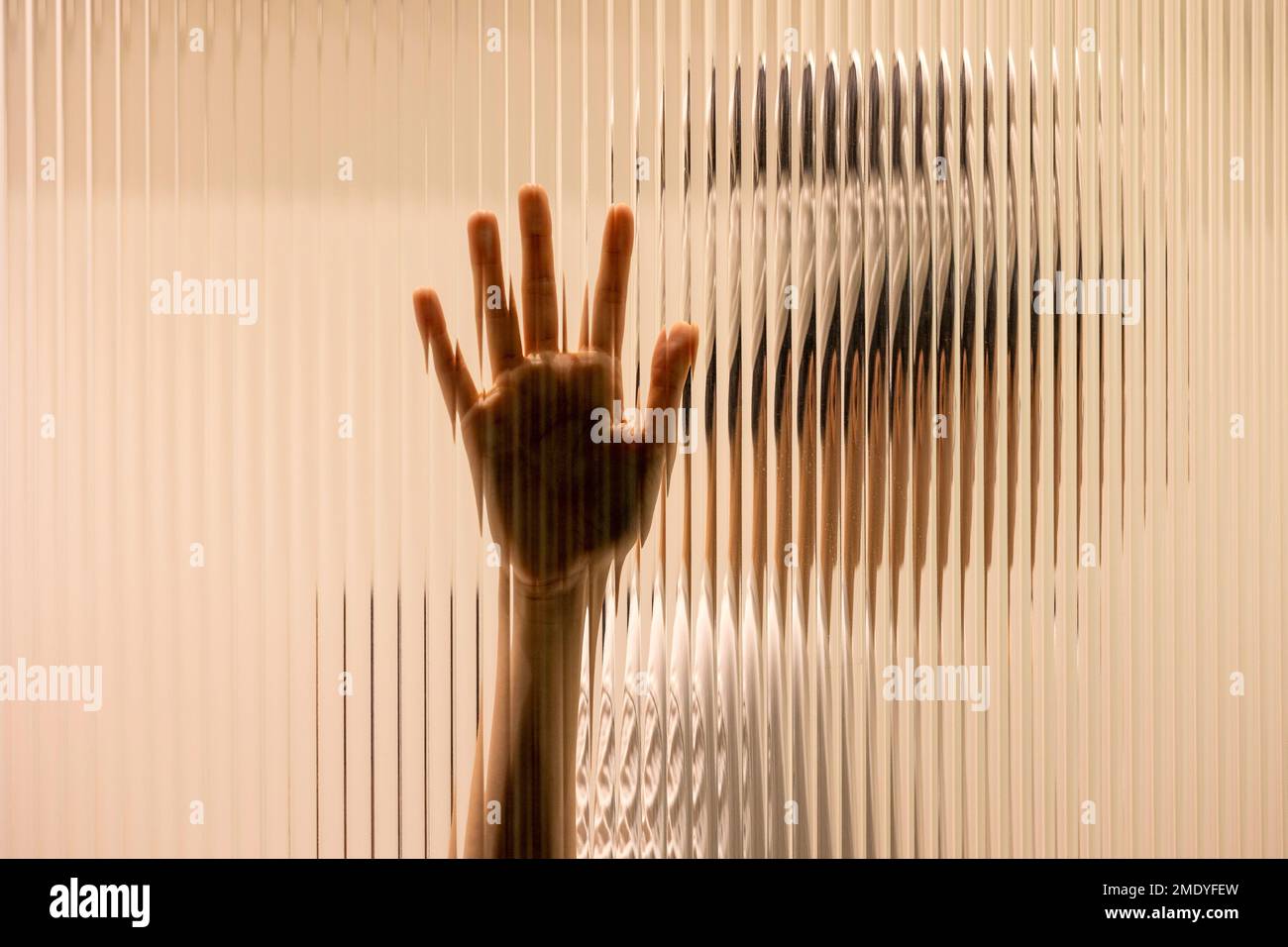 One hand on the textured glass Stock Photo - Alamy