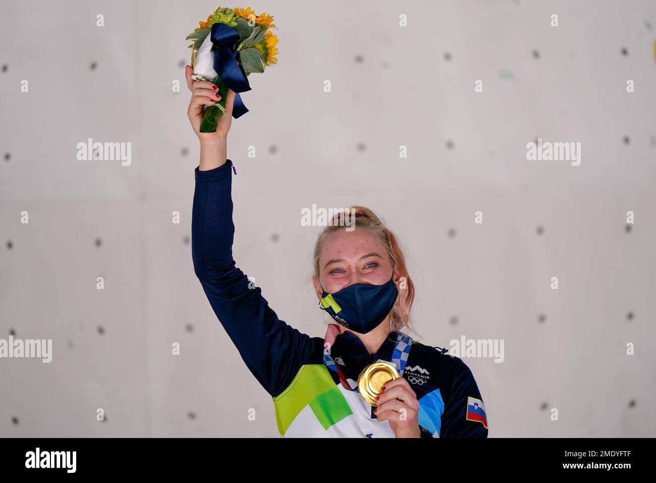 Gold Medalist Janja Garnbret Of Slovenia Stands On The Olympic Podium