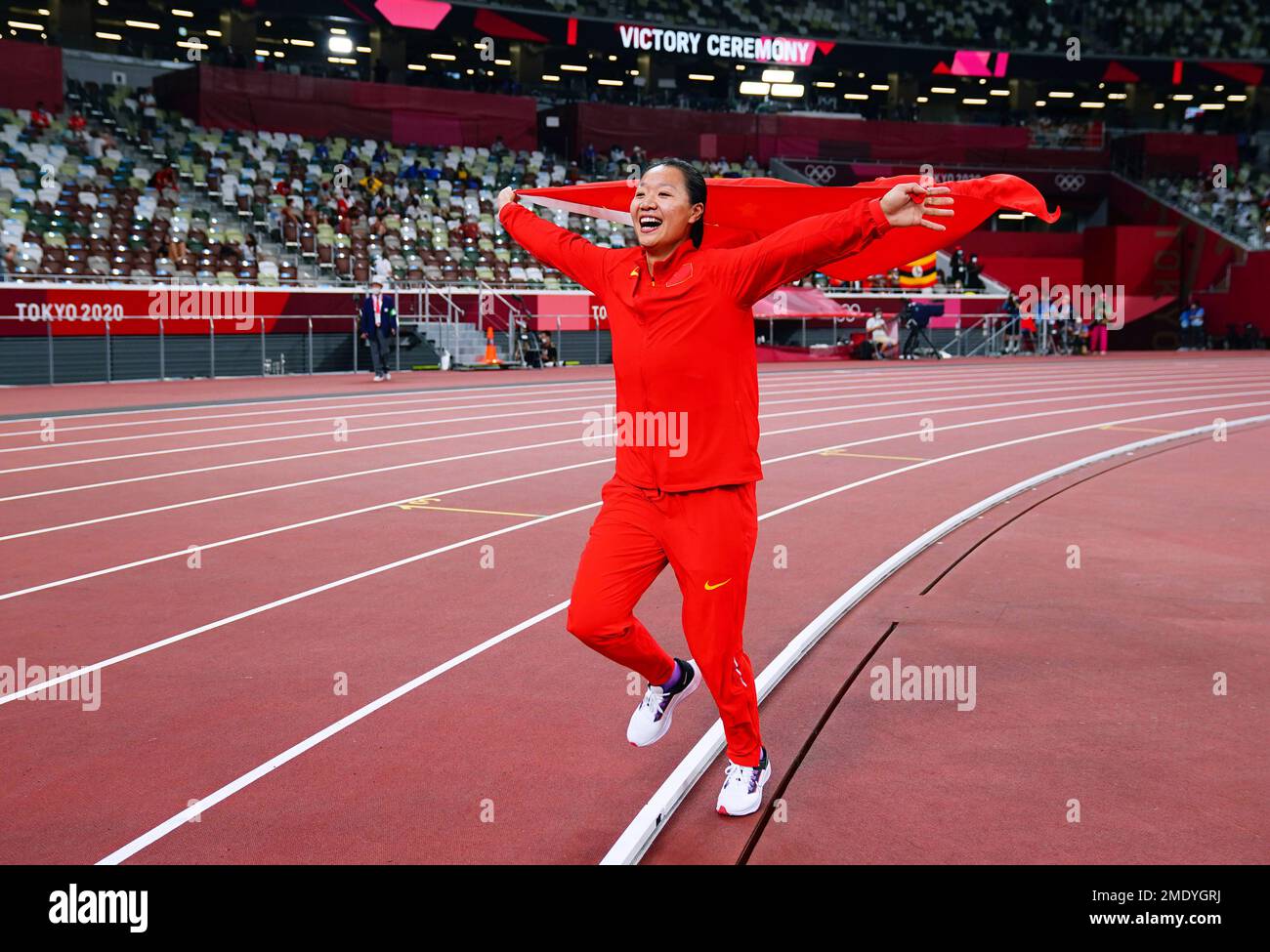 Liu Shiying of China celebrates with the national flag after winning ...