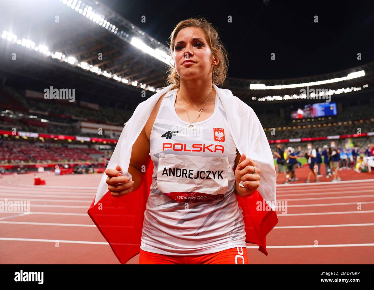Maria Andrejczyk of Poland celebrates with the national flag after ...