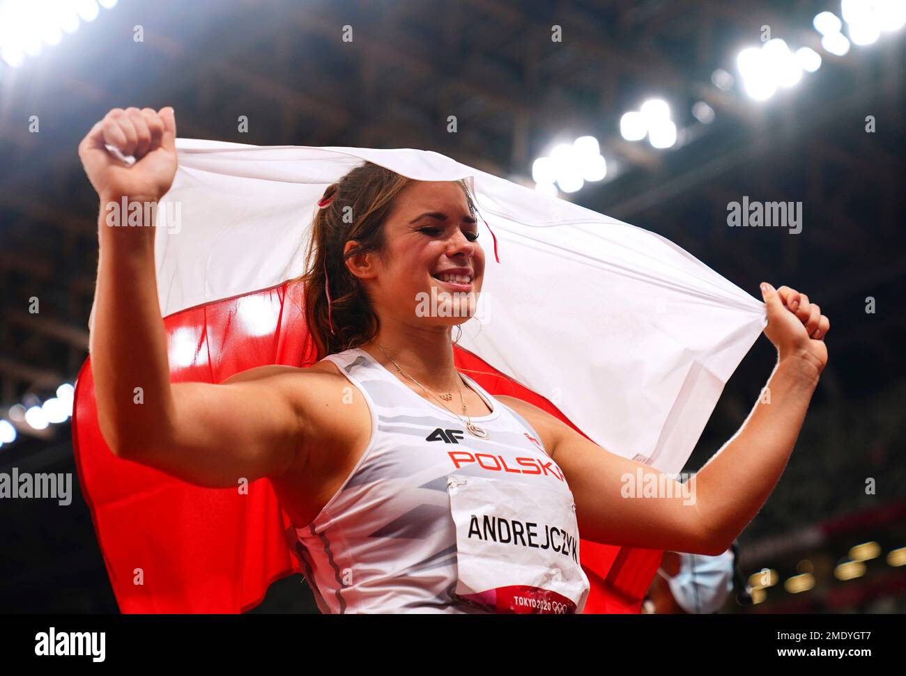 Maria Andrejczyk of Poland celebrates with the national flag after ...