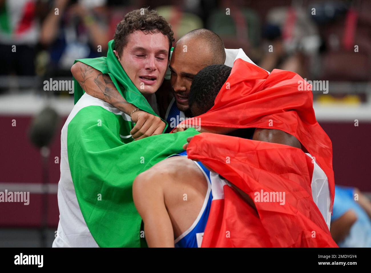 The team from Italy celebrates after winning the gold medal in the men ...