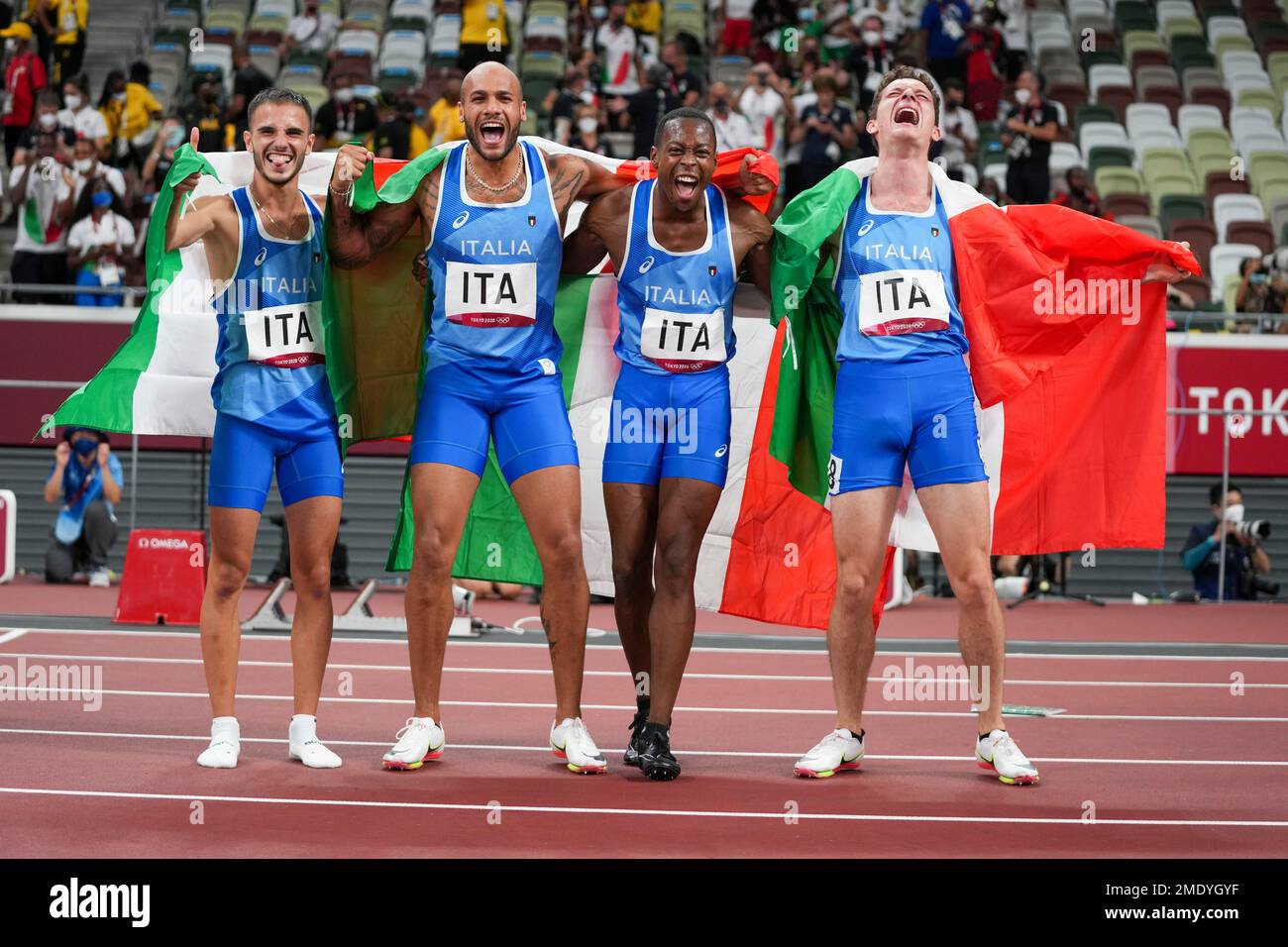 The team from Italy celebrates after winning the gold medal in the men ...