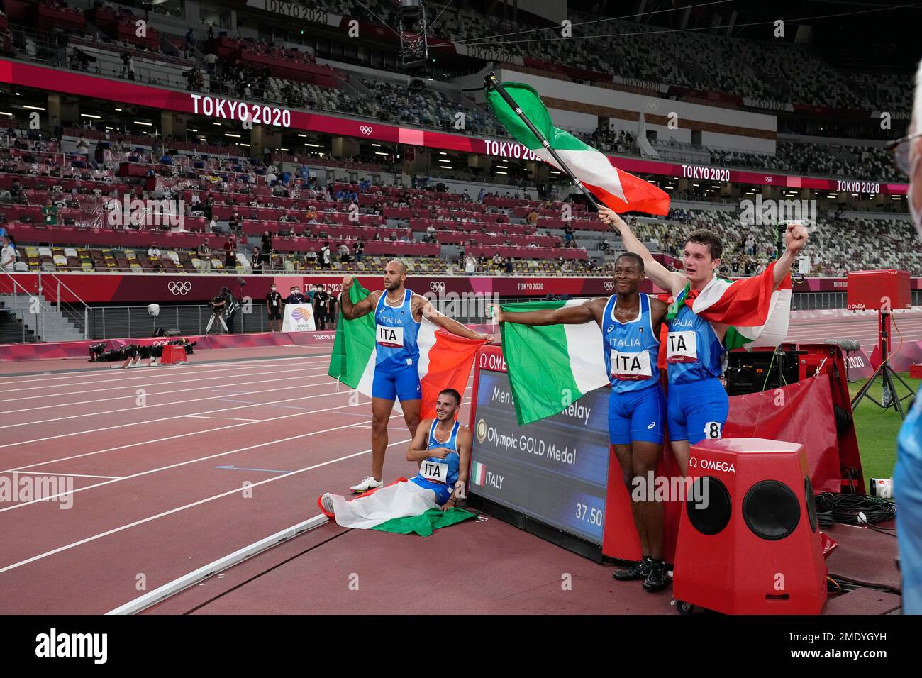 The team from Italy celebrates after winning the gold medal in the men ...