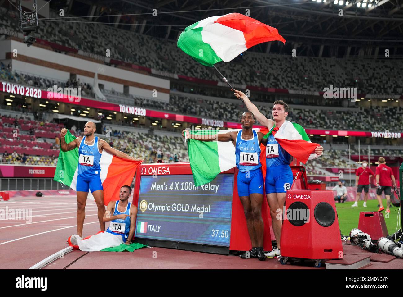 The team from Italy celebrates after winning the gold medal in the men ...
