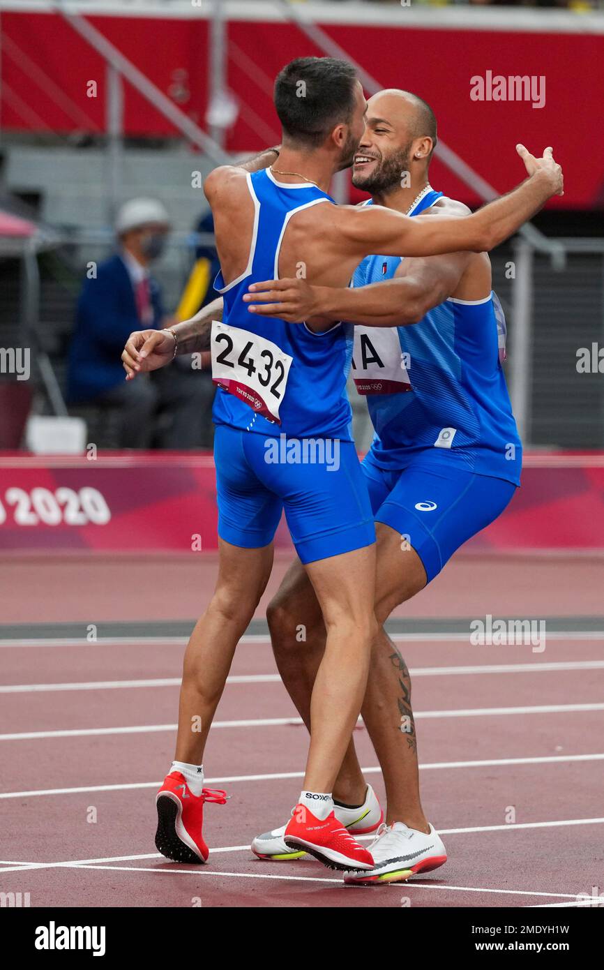 The team from Italy celebrates after winning the gold medal in the men ...