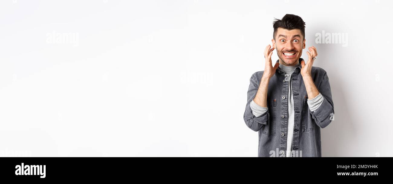 Angry man clench teeth and stare with hatred and anger at camera ...