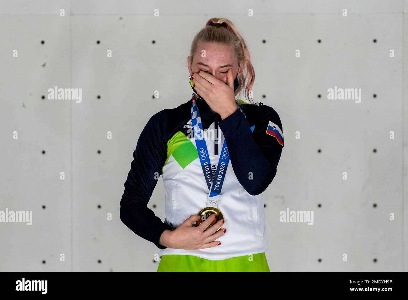 Gold medalist Janja Garnbret, of Slovenia, poses at the Olympic podium ...