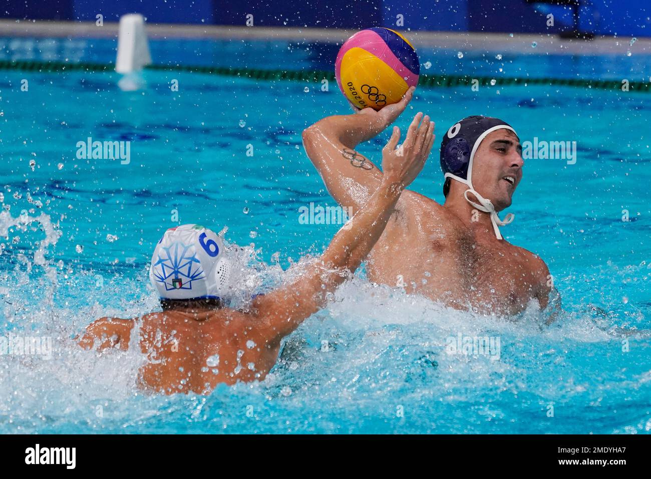 United States' Luca Cupido, right, shoots as Italy's Alessandro Velotto ...