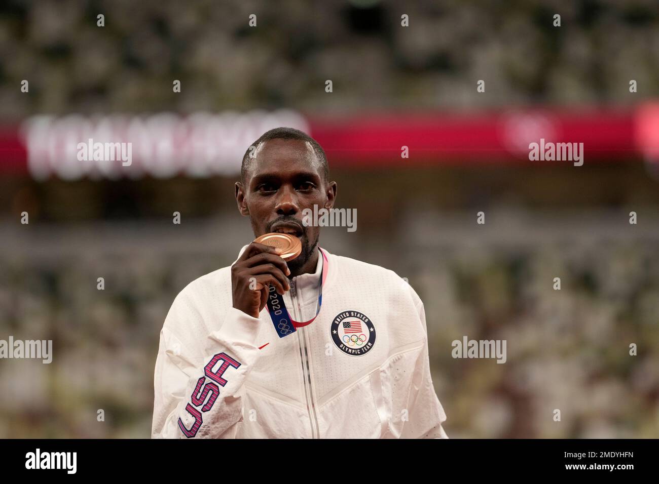 Bronze medalist Paul Chelimo, of the United States, poses during the ...
