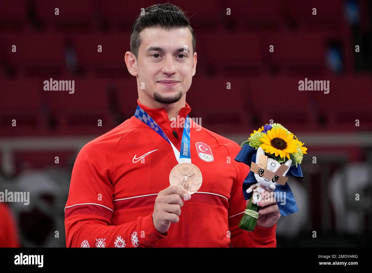 Bronze medalist Ali Sofuoglu of Turkey poses during the medal ceremony for men's kata karate at ...
