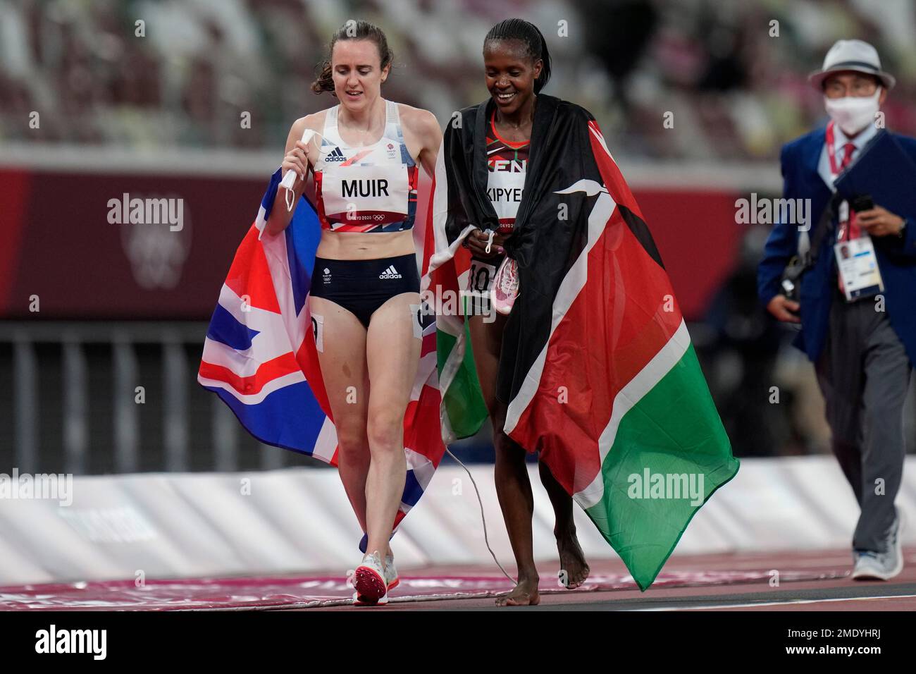 Faith Kipyegon, right, of Kenya, and Laura Muir, of Britain, walk the ...