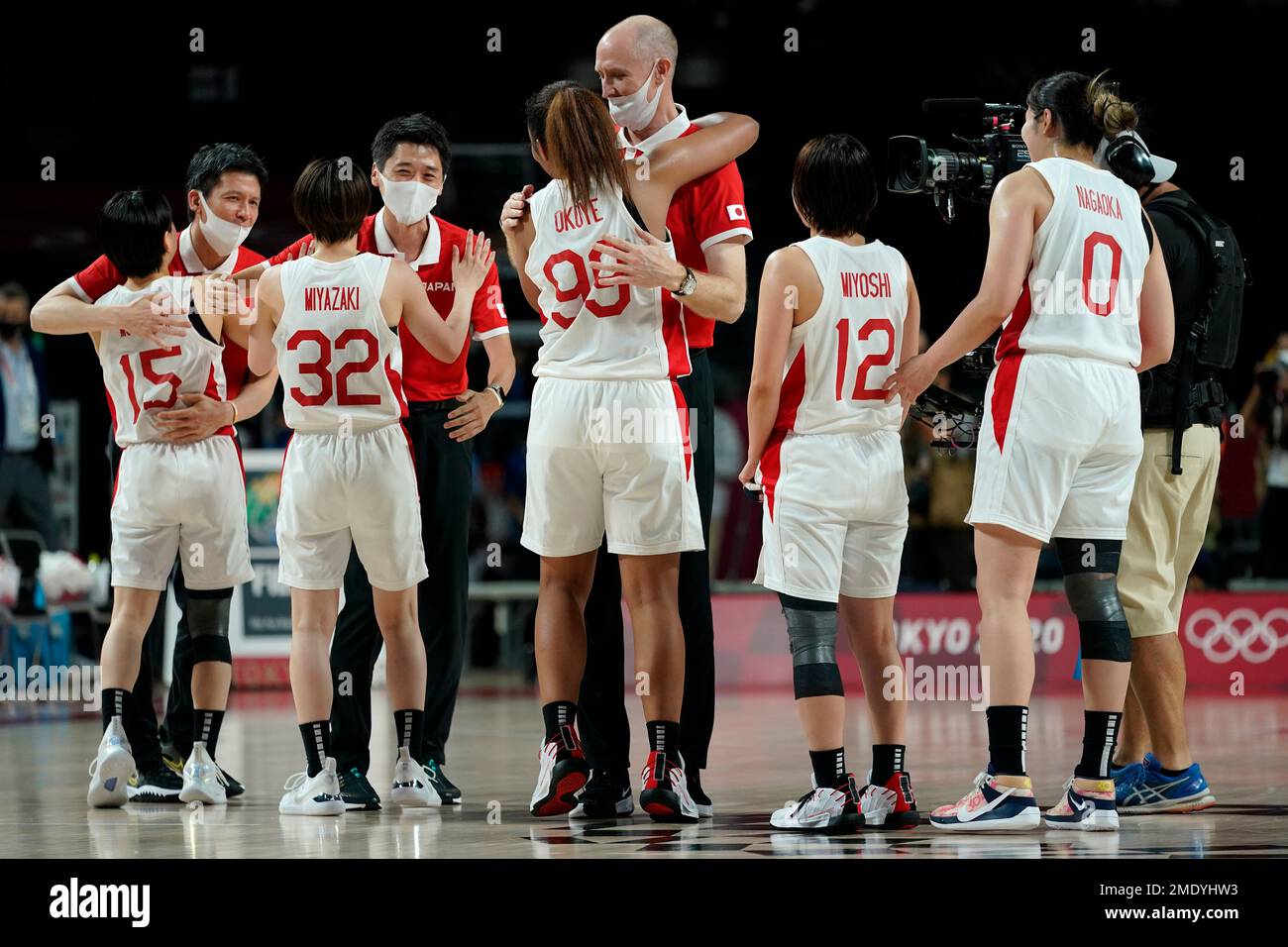Japan head coach Thomas Hovasse celebrates with his team after a women ...