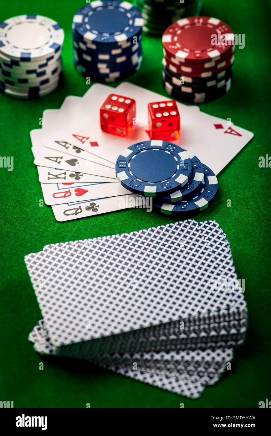 Playing cards, dice and poker chips , casino poker chips on green ...