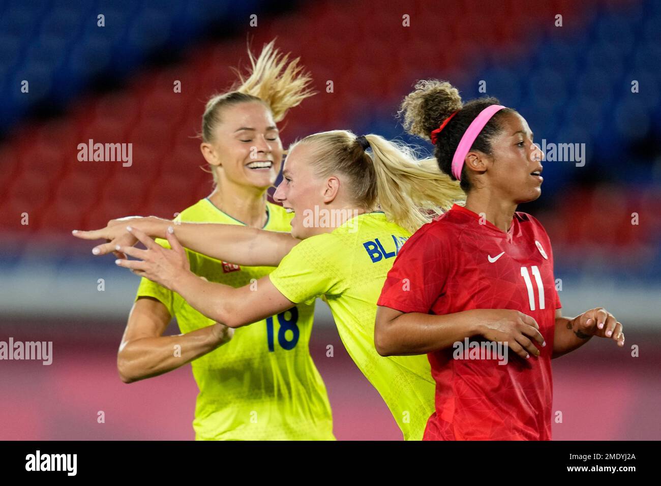 Sweden's Stina Blackstenius, center, celebrates scoring the opening ...