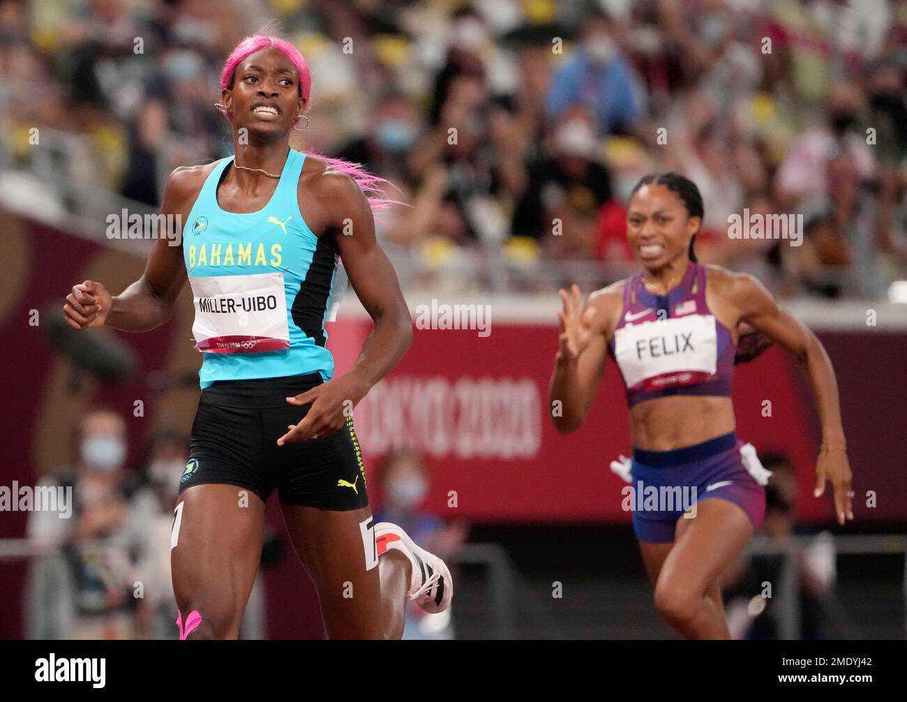 Shaunae Miller-Uibo, of Bahamas crosses the line to win the gold medal ...