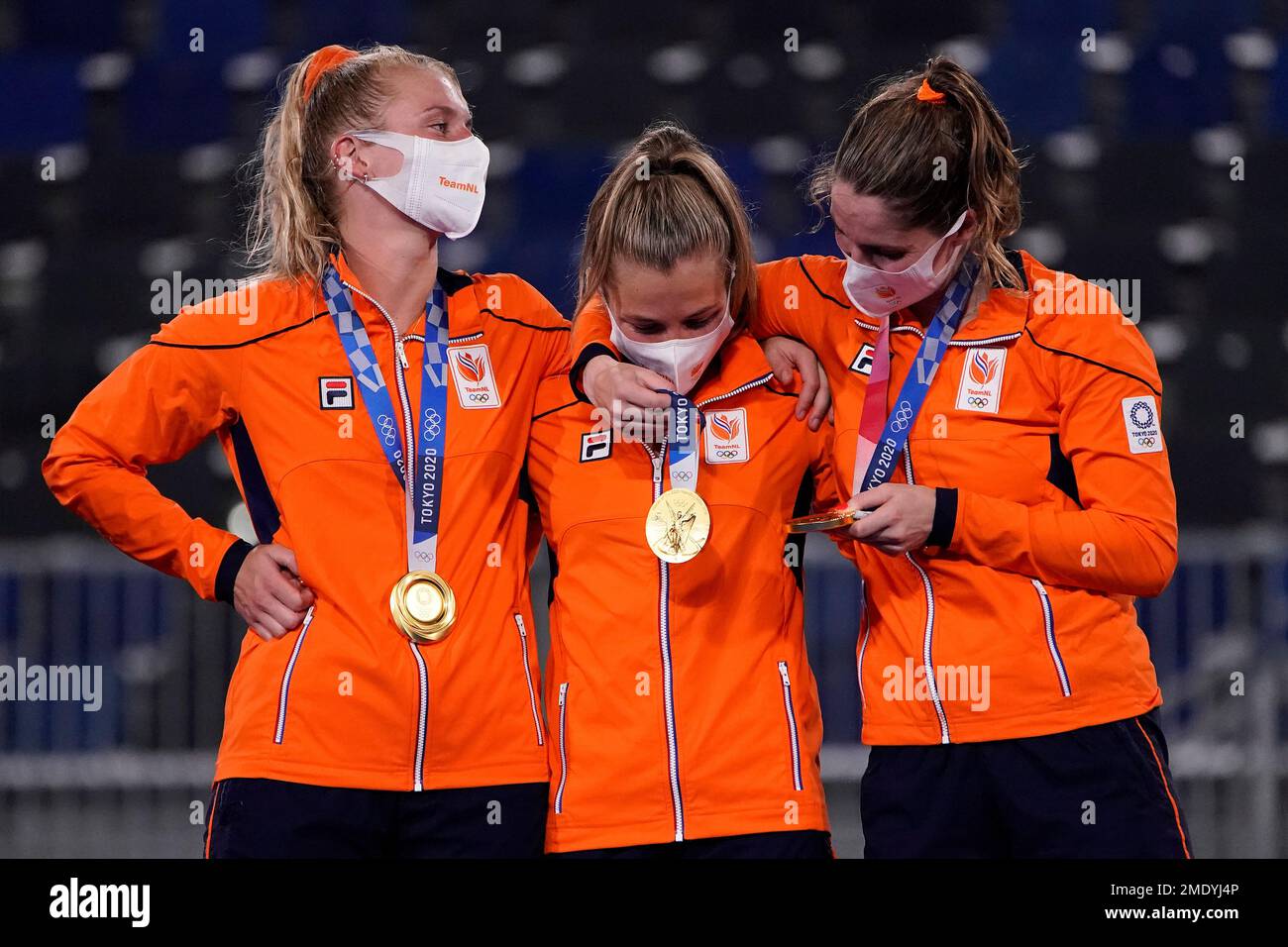 Netherlands players look at their gold medals after defeating Argentina ...