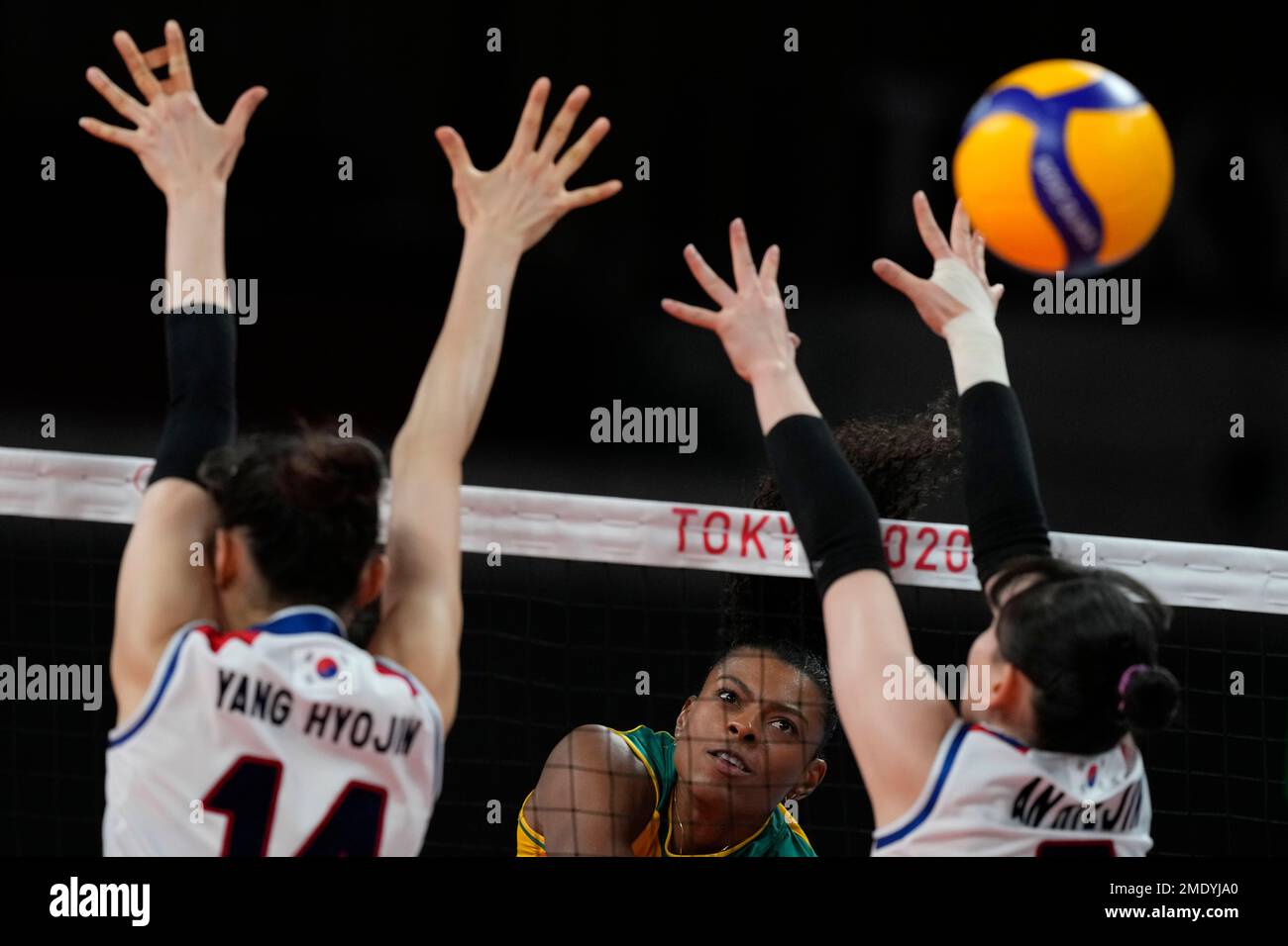 Brazils Fernanda Garay Rodrigues Hits A Ball Past South Koreas Yang Hyo Jin And Ahn Hye Jin
