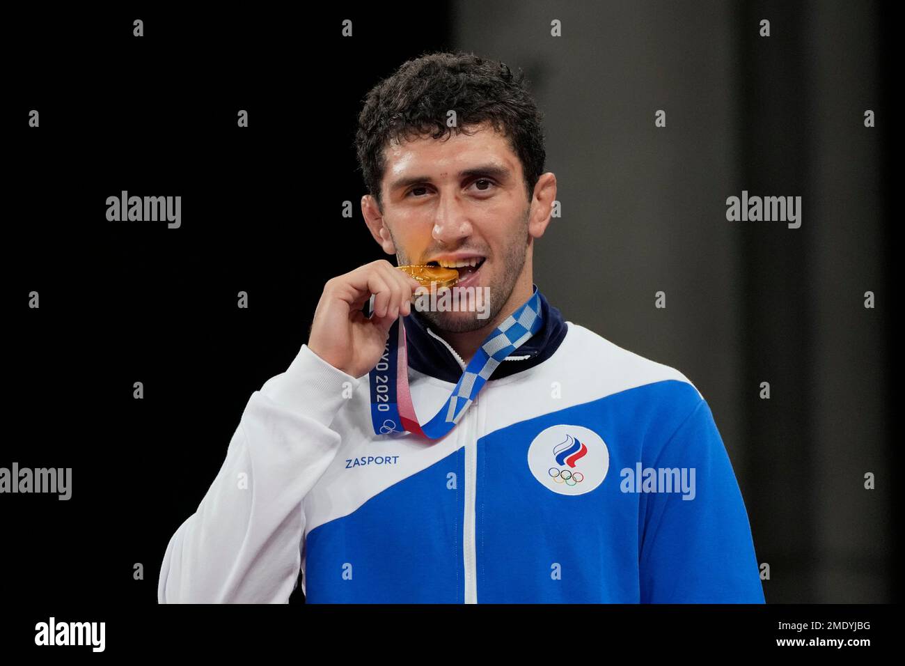 Russian Olympic Committee's Zaurbek Sidakov celebrates with his gold ...