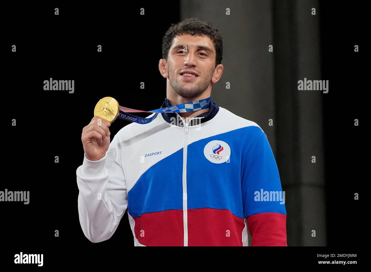 Russian Olympic Committee's Zaurbek Sidakov celebrates with his gold ...