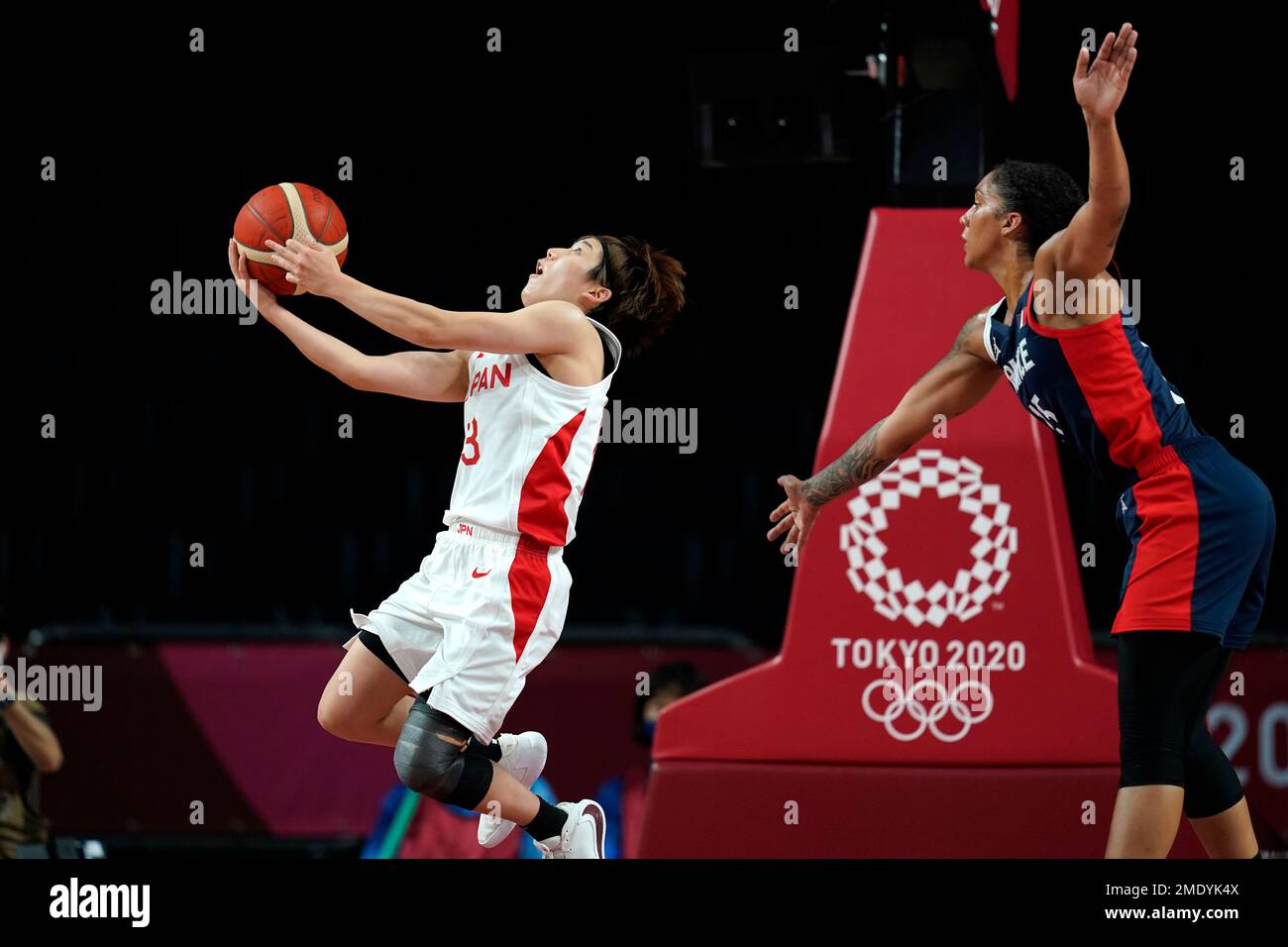 Japan's Rui Machida drives to the basket ahead of France's Gabrielle ...