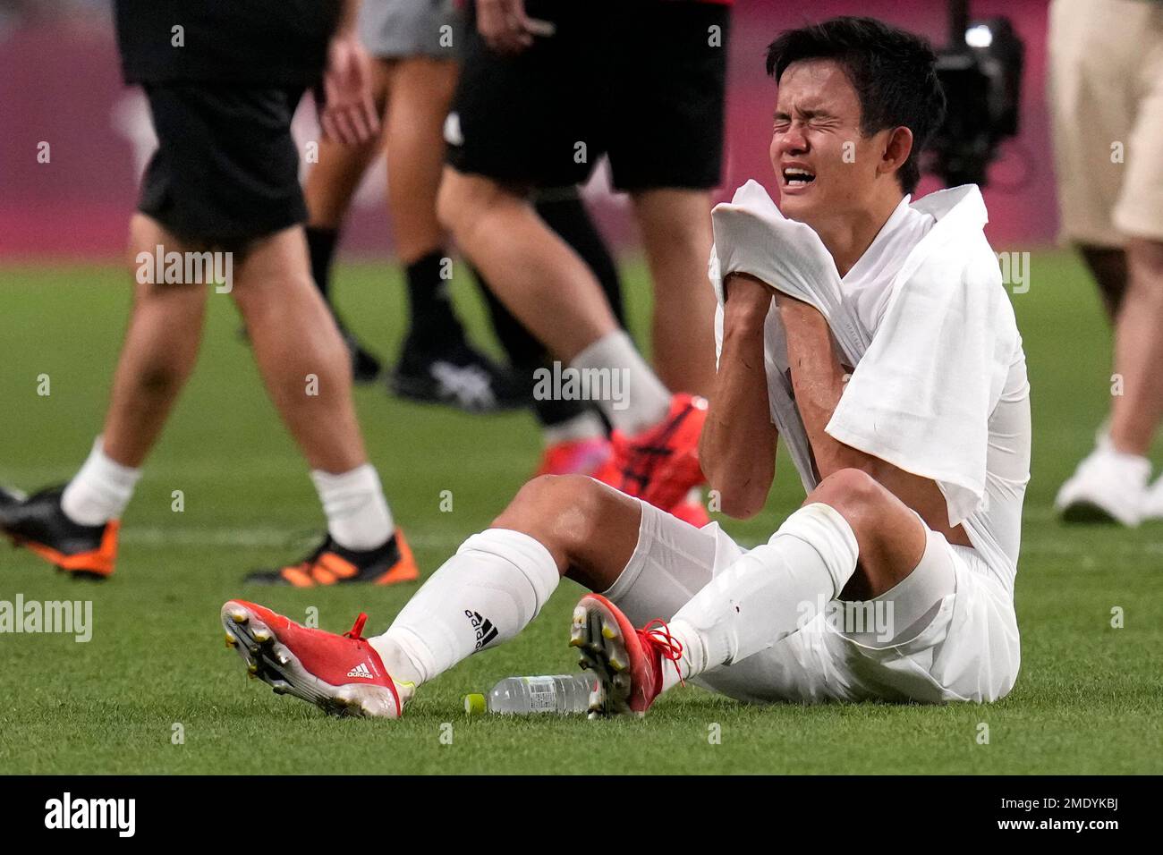 Japan's Takefusa Kubo cries after losing 1-3 to Mexico during the men's ...