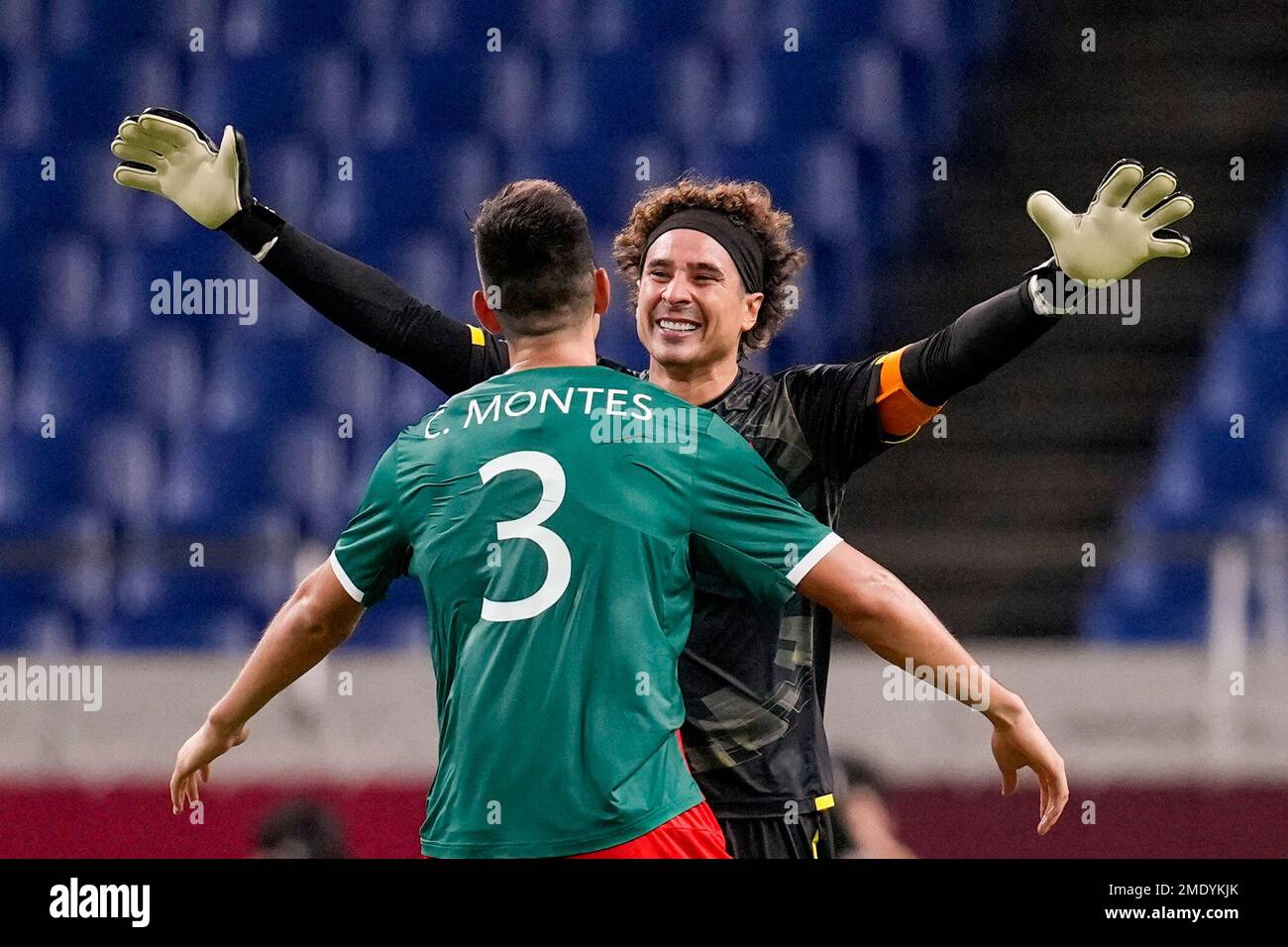 Mexico's goalkeeper Guillermo Ochoa embraces Cesar Montes after beating ...