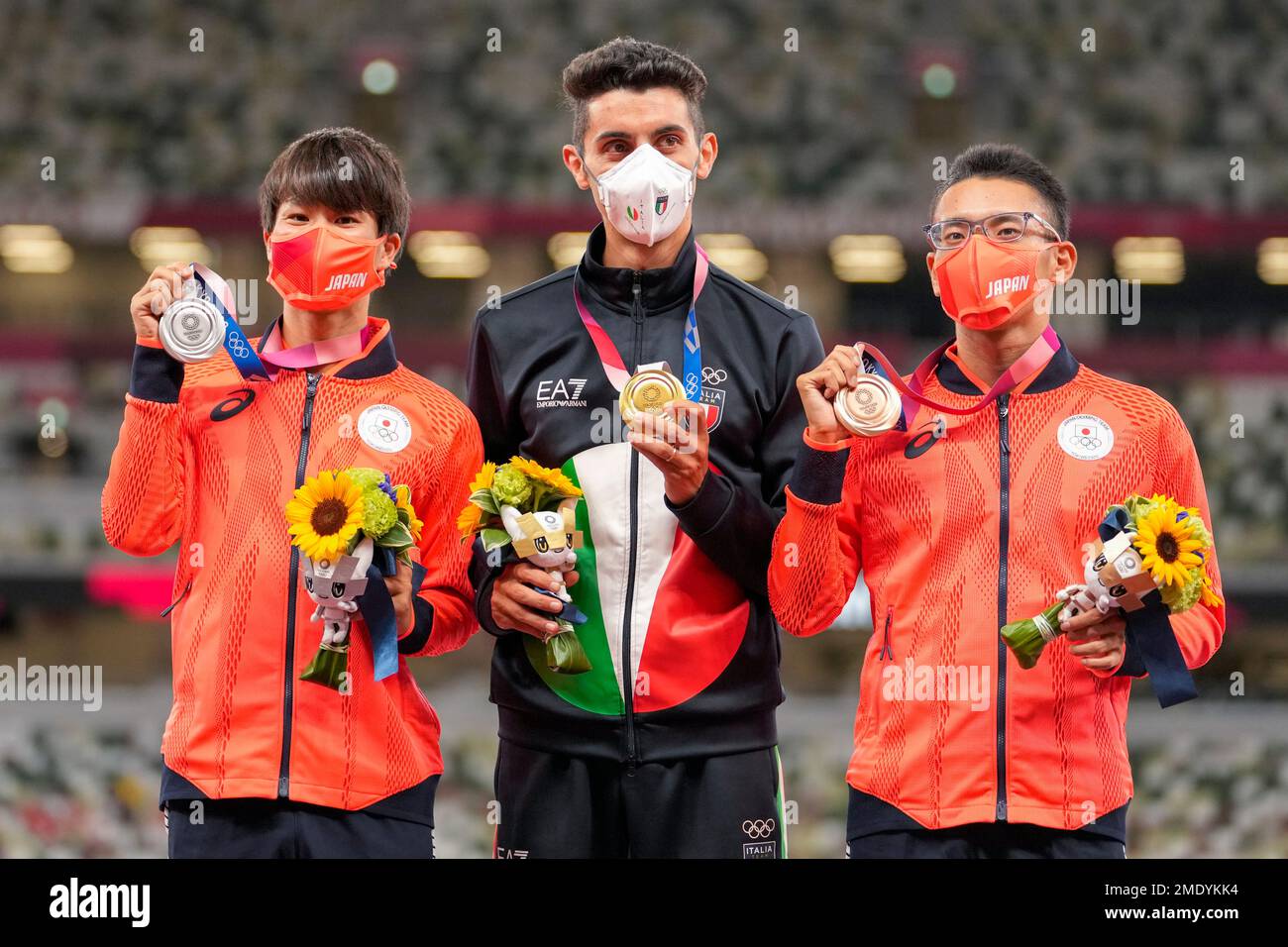 Gold medalist Massimo Stano, of Italy, center, stands with silver ...