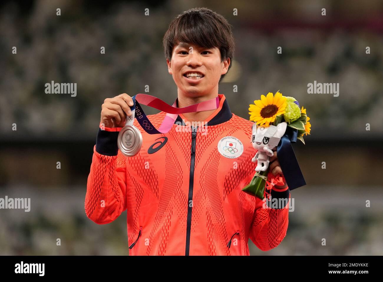 Silver medalist Koki Ikeda, of Japan, poses during the medal ceremony ...