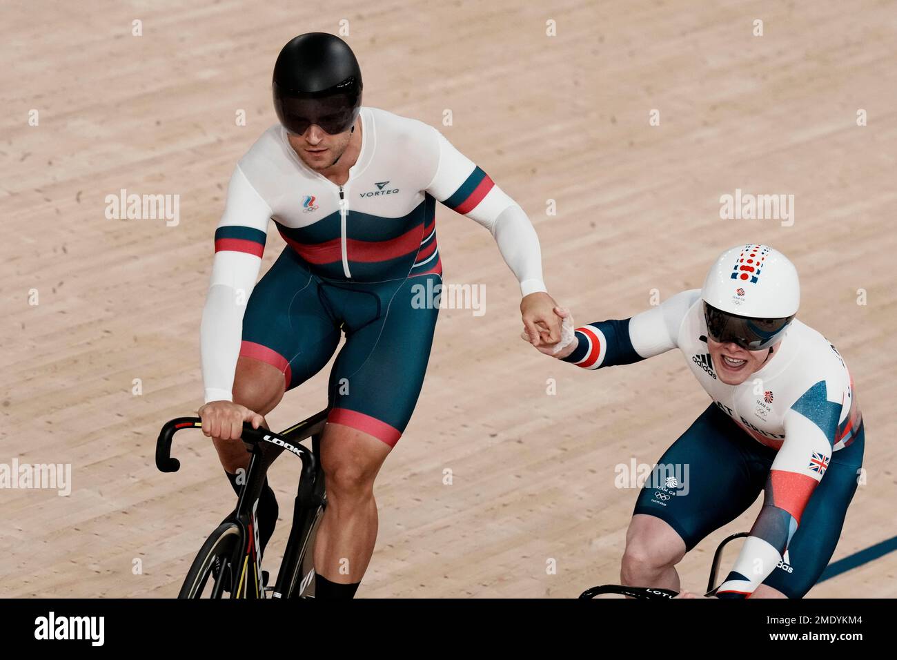 Jack Carlin of Team Britain, right, celebrates winning the bronze medal ...