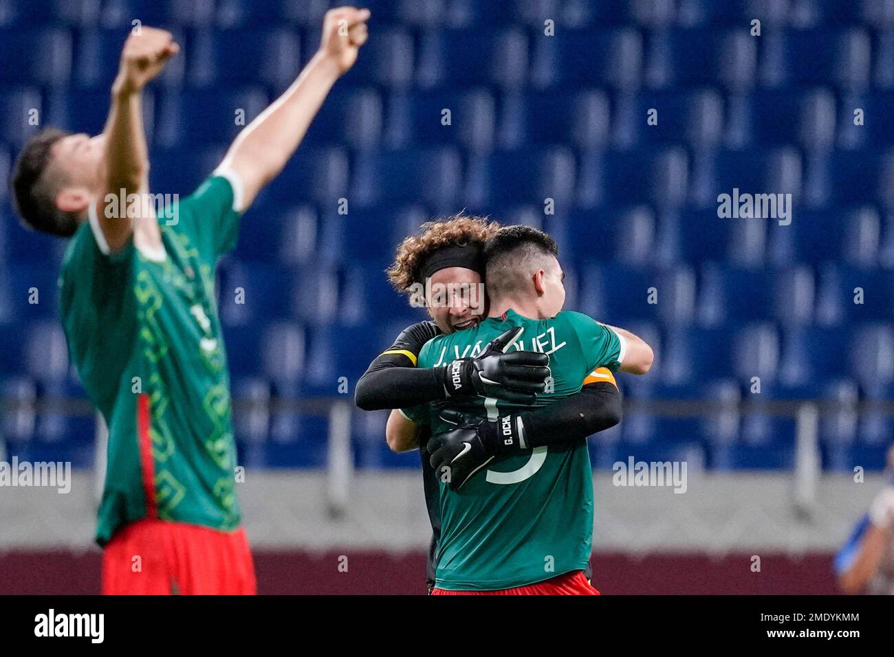 Mexico's goalkeeper Guillermo Ochoa embraces teammate Johan Vasquez ...