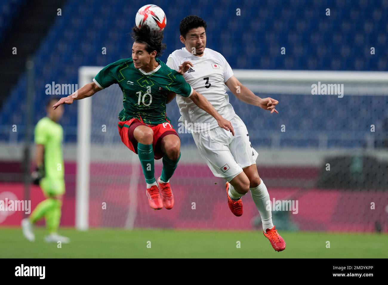 Mexico's Diego Lainez, left, ad Japan's Yuta Nakayama go for a header ...
