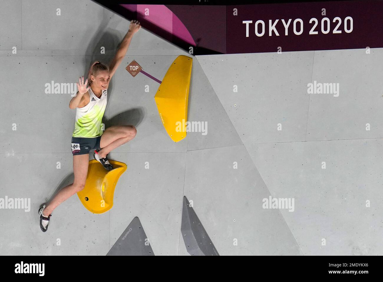 Janja Garnbret Of Slovenia Waves After Reaching The Top During The