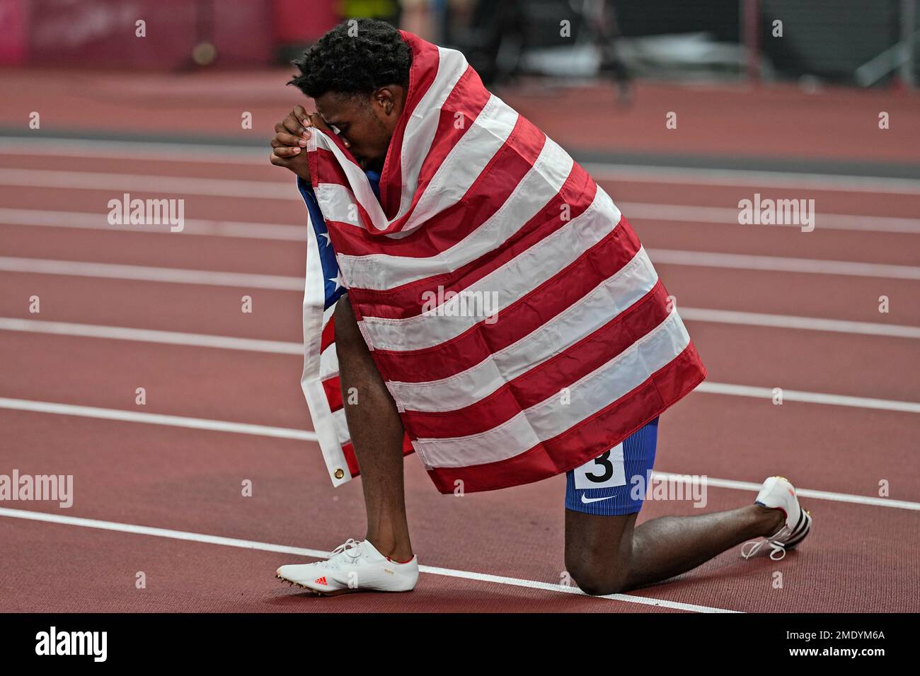Noah Lyles, of the United States, reacts after his third place finish ...