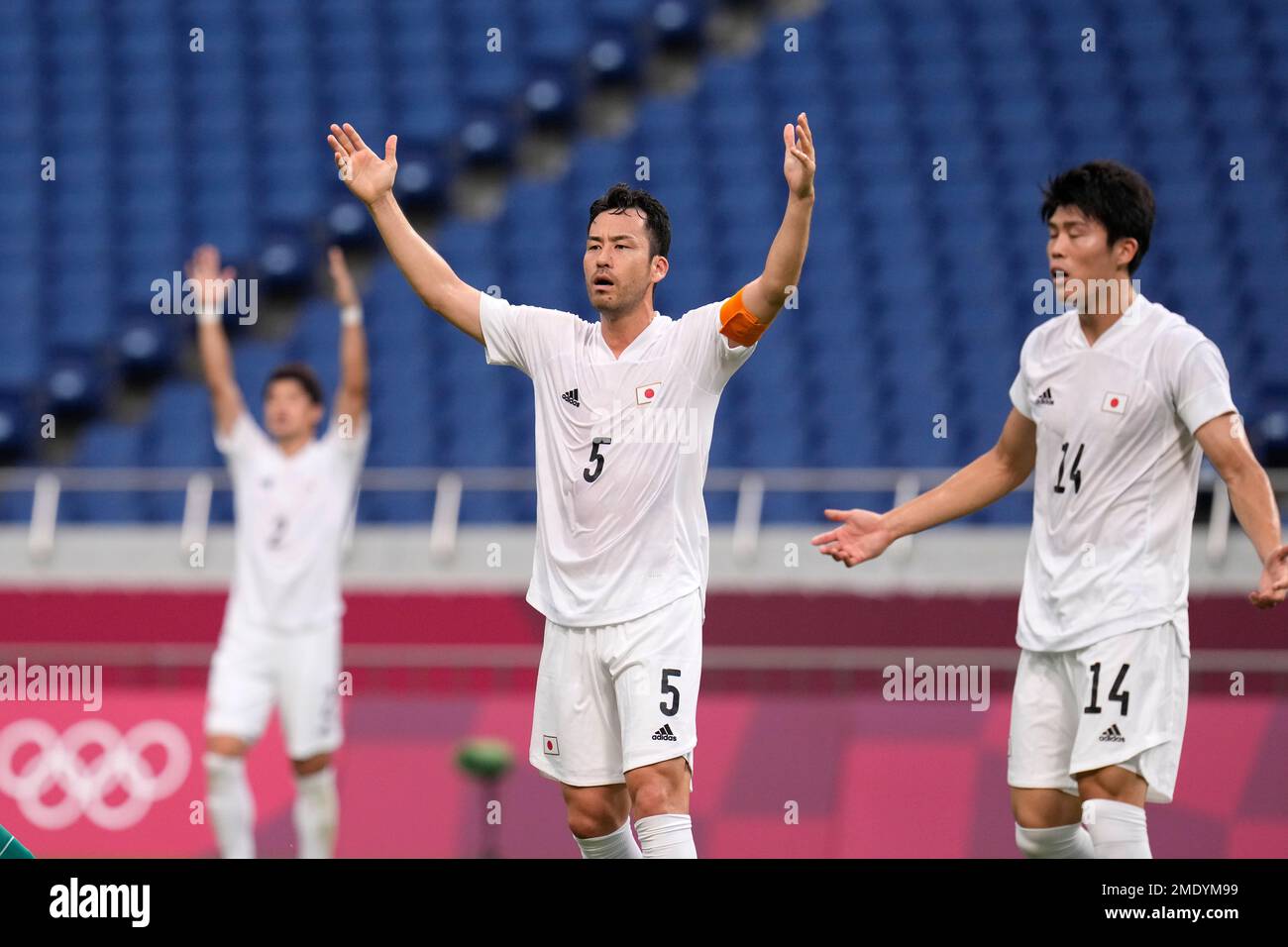 Japan's Maya Yoshida, center, reacts during the men's bronze medal ...