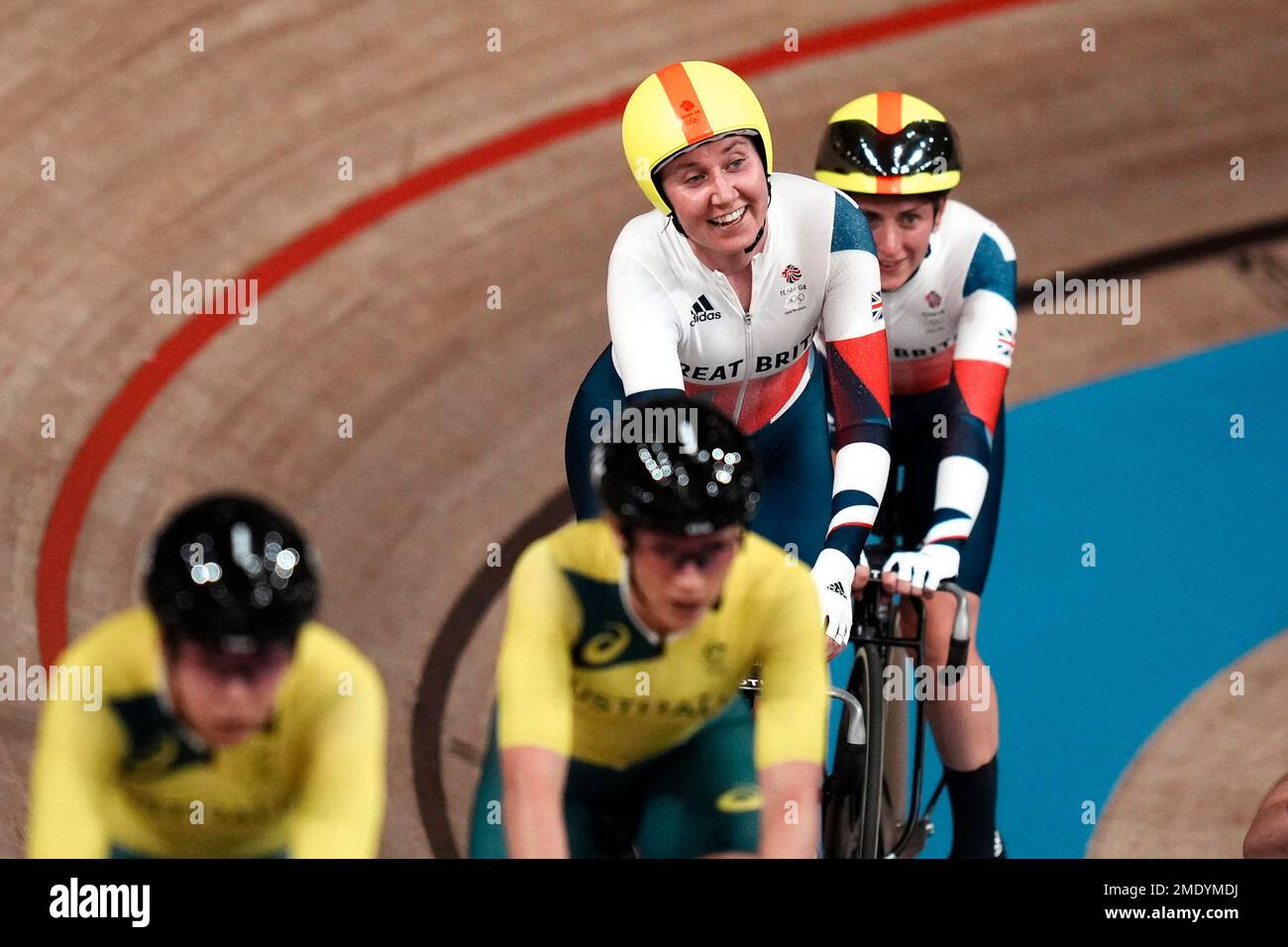 Kate Archibald of Team Britain, and teammate Laura Kenny, behind react ...