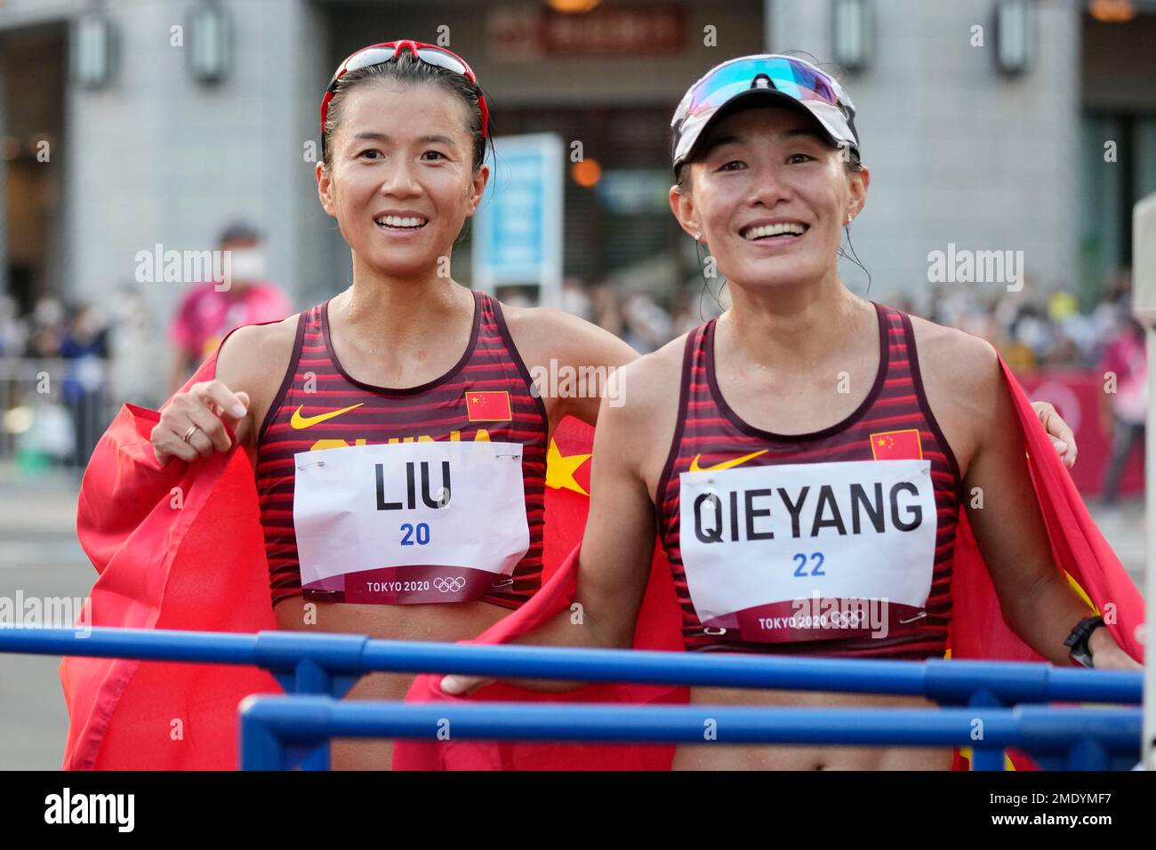 Bronze medalist Liu Hong of China, left, is flanked by her teammate ...