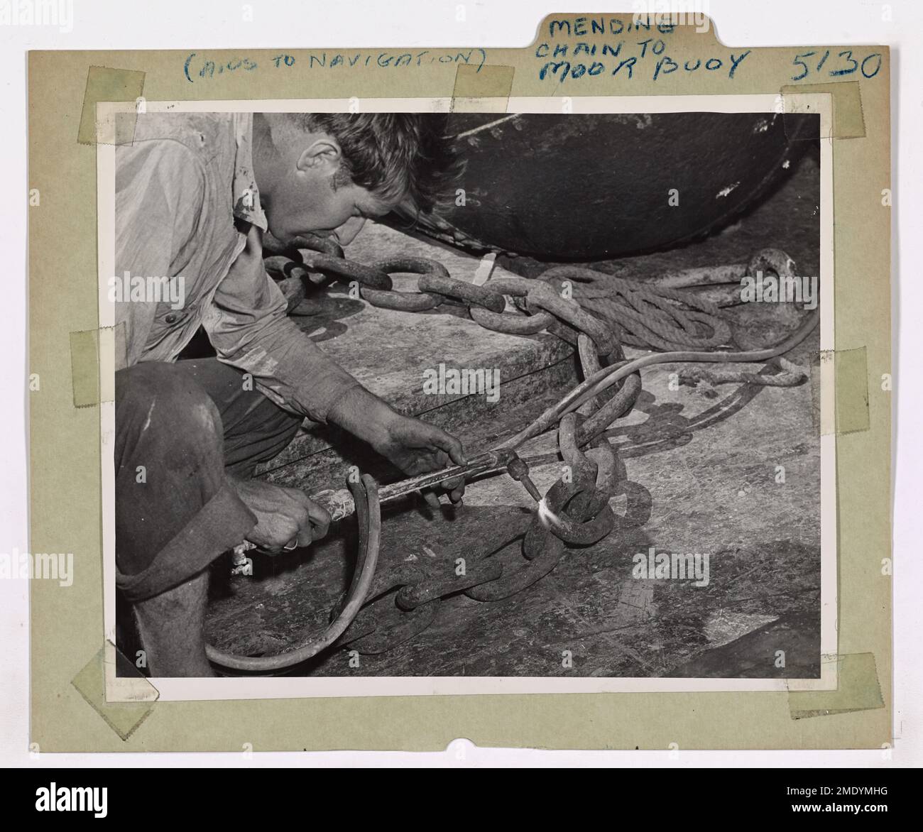 Mending A Chain With Which To Moor A Buoy. On the deck of a Coast Guard ...