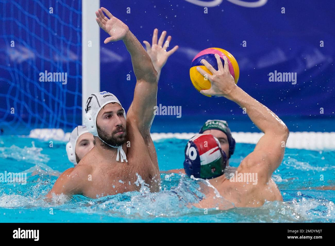 Greece's Angelos Vlachopoulos (12) defends against Hungary's Denes ...