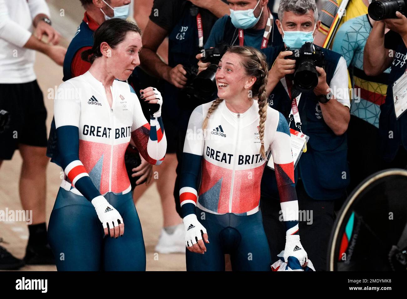 Laura Kenny, right, and Kate Archibald, of Team Britain, react after ...