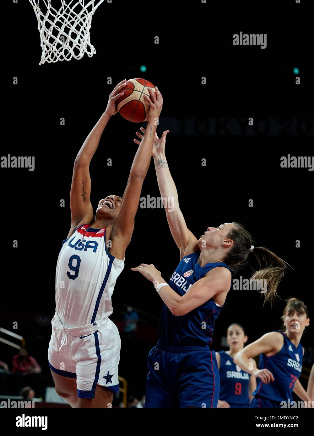 United States' A'Ja Wilson (9) grabs a rebound over Serbia's Nevena ...