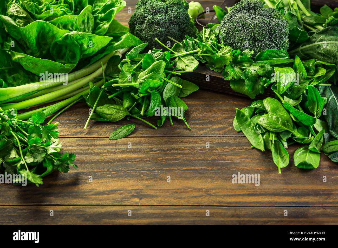 Green organic vegetables and dark leafy food background as a healthy ...