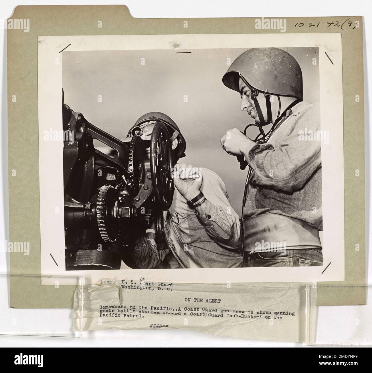 A Coast Guard gun crew mans their battle station aboard a 'sub-Buster ...