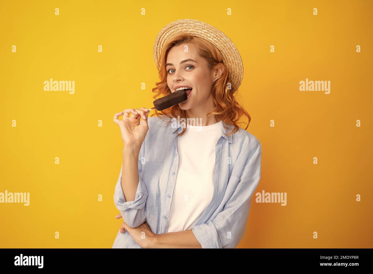 Portrait of cheerful funny teenage girl enjoys eating cold frozen ...