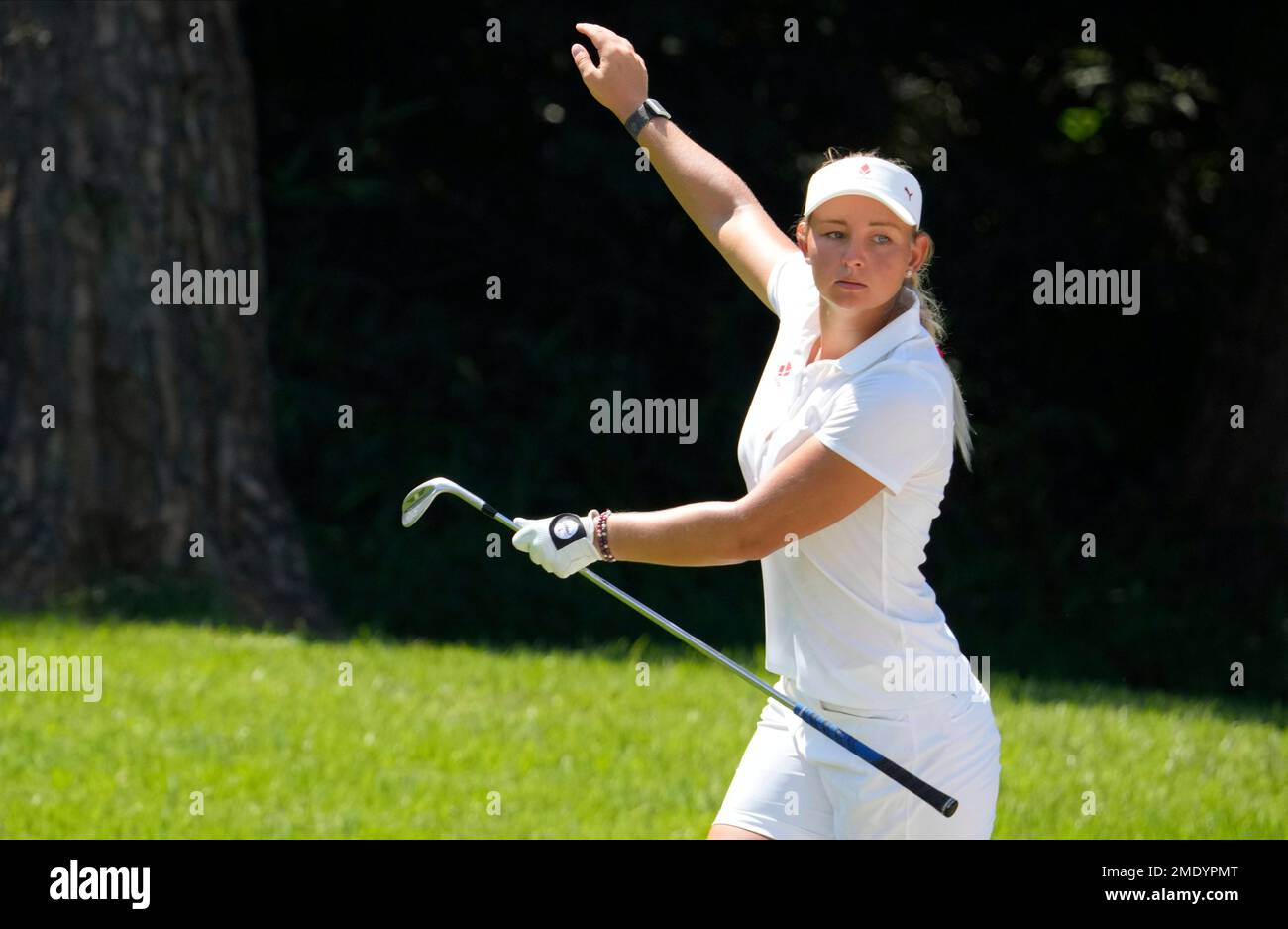 Emily Pedersen, of Denmark, watches her shot from a bunker on 16th hole ...